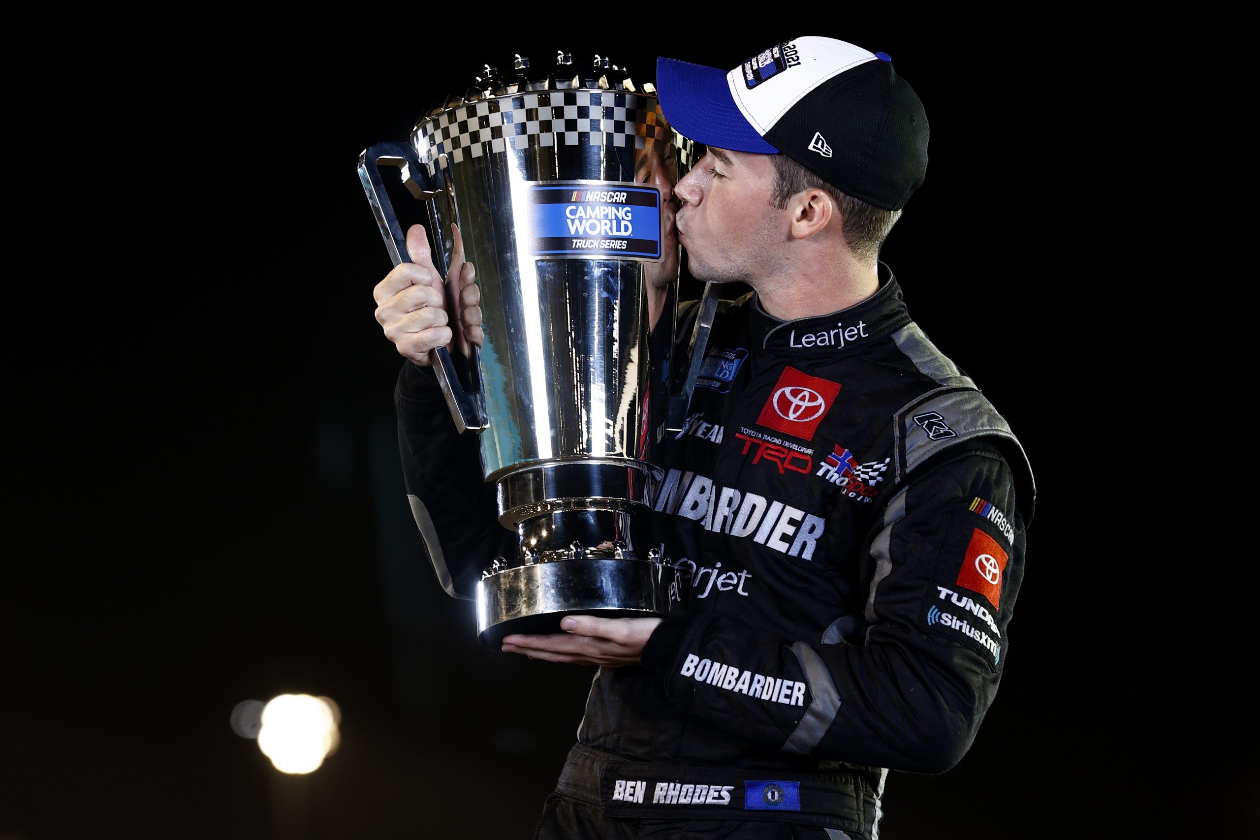Portraits of a champion: 2021 title winners with their trophies | NASCAR