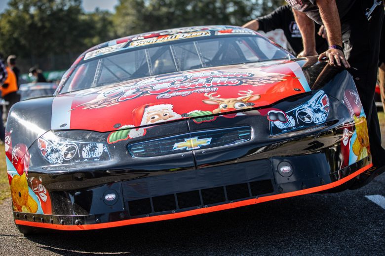 Christmas themed race cars at the Snowball Derby - Official Site Of NASCAR