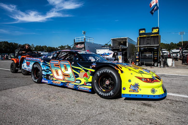 Christmas themed race cars at the Snowball Derby - Official Site Of NASCAR